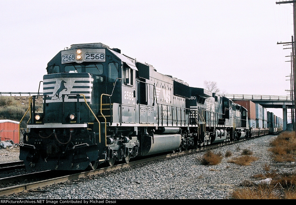 NS SD-70 #2568 leads an all NS lashup with a westbound stacker at Impala Rd.